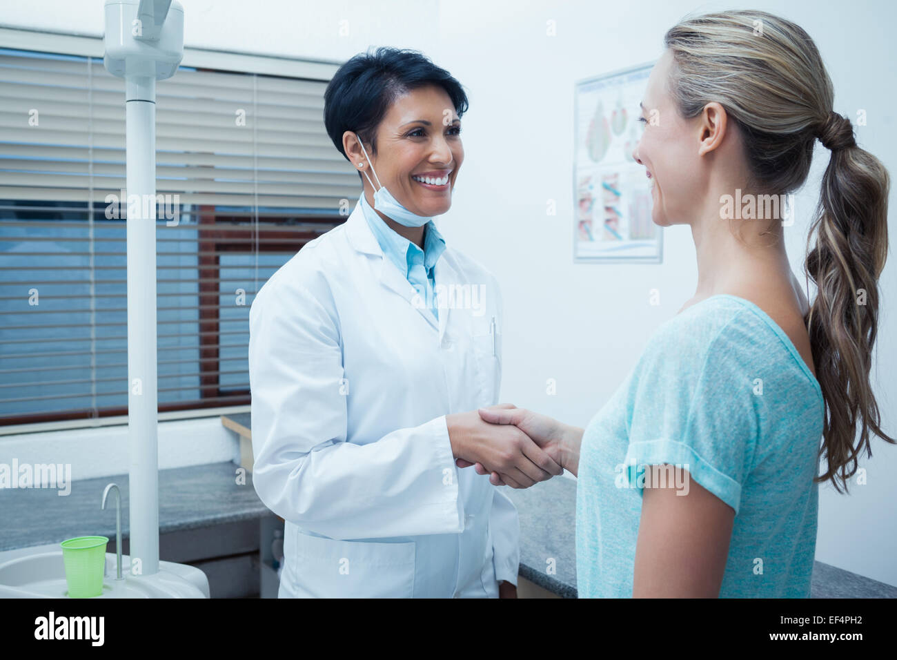 Female dentist greeting patient hi-res stock photography and images - Alamy
