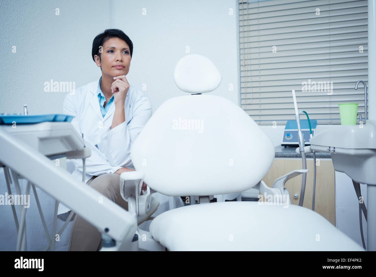 Thoughtful young female dentist Stock Photo - Alamy Thoughtful young female dentist Stock Photo - Alamy