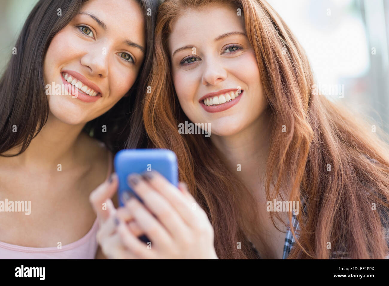 Pretty students smiling at camera Stock Photo - Alamy