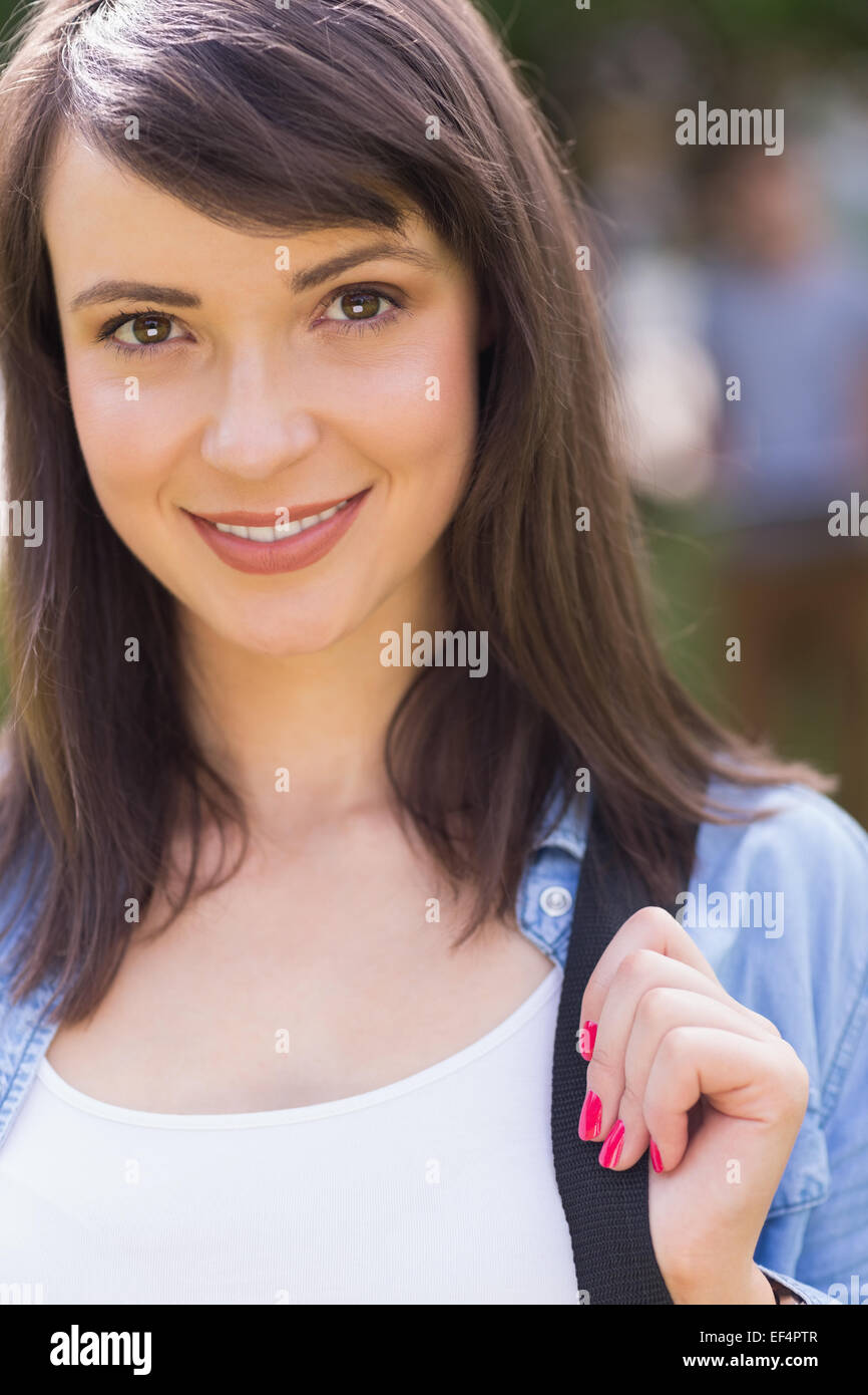 Pretty student smiling at camera outside on campus Stock Photo - Alamy