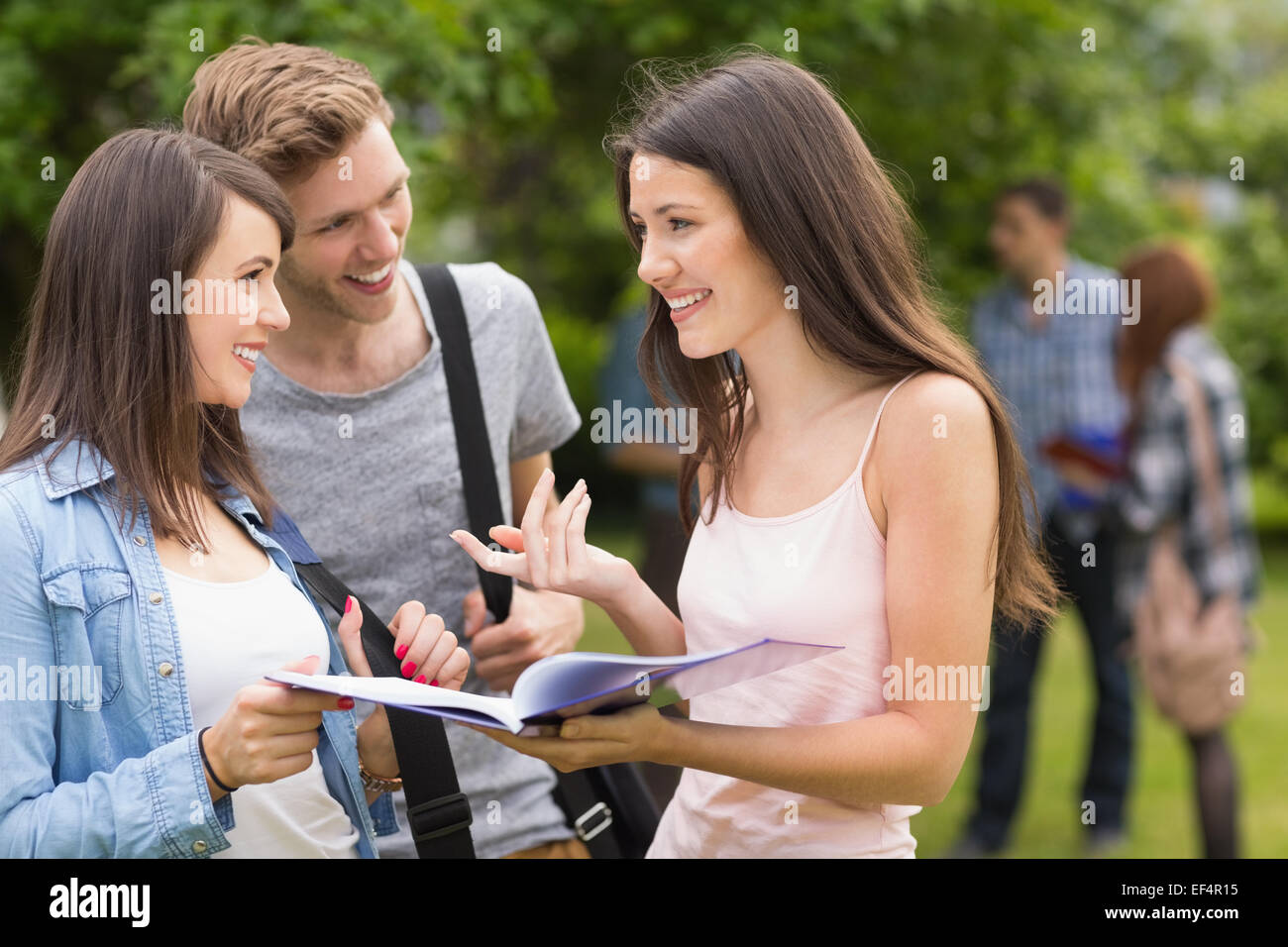 Happy students reading hi-res stock photography and images - Alamy