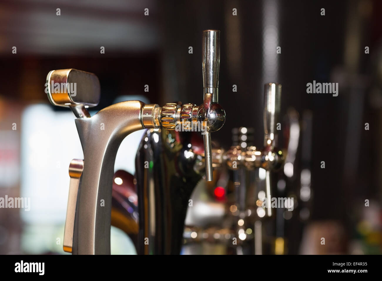 Row beer pumps hi-res stock photography and images - Alamy