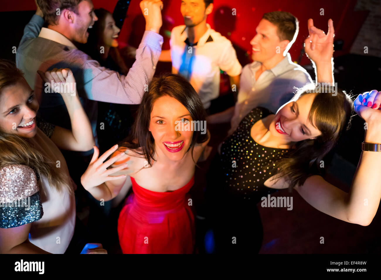 Happy friends dancing and smiling Stock Photo - Alamy