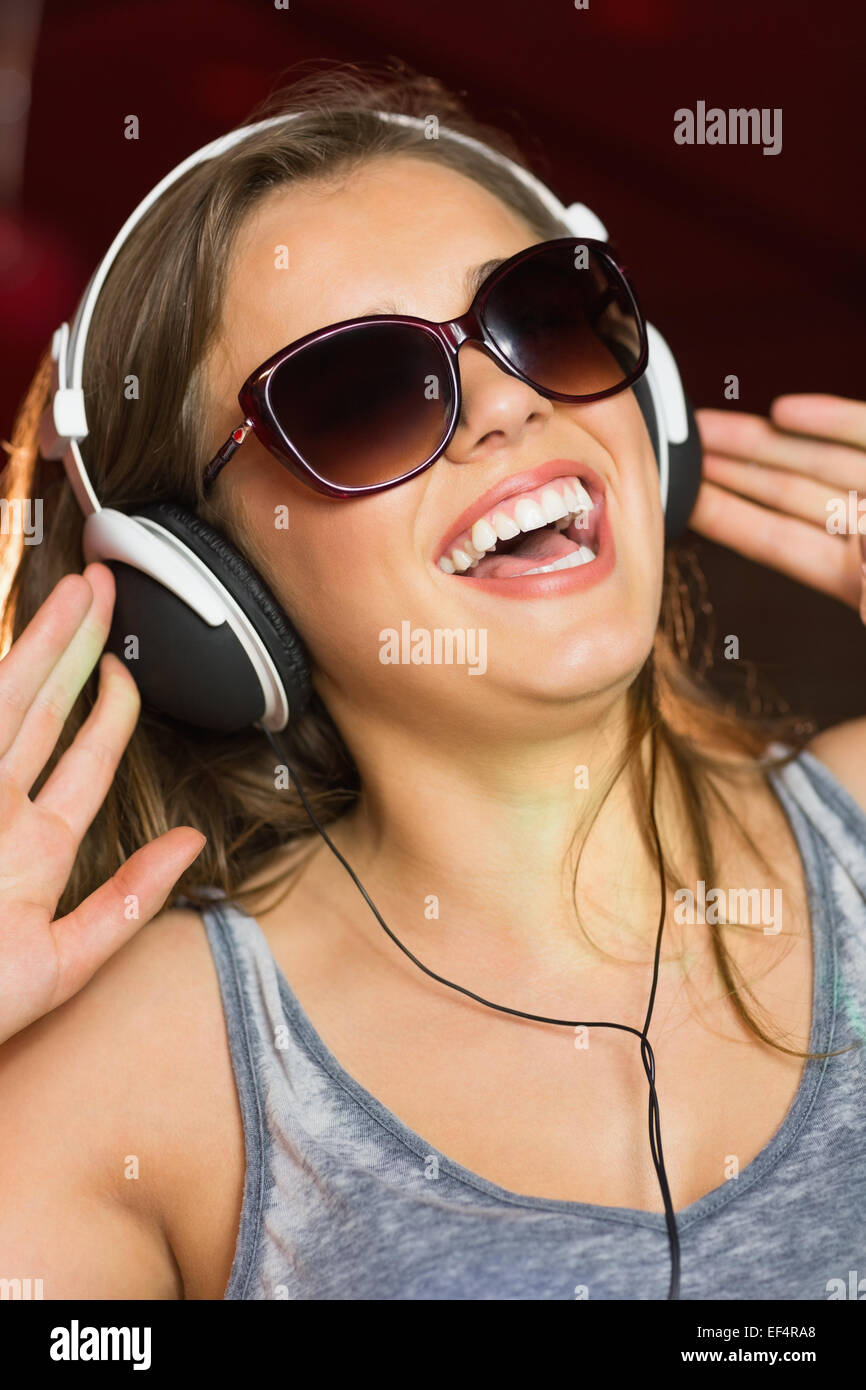 Pretty dj smiling and dancing Stock Photo - Alamy