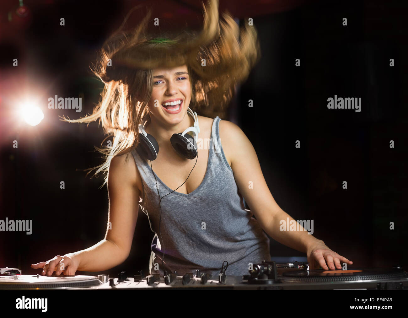 Pretty dj smiling and dancing Stock Photo - Alamy