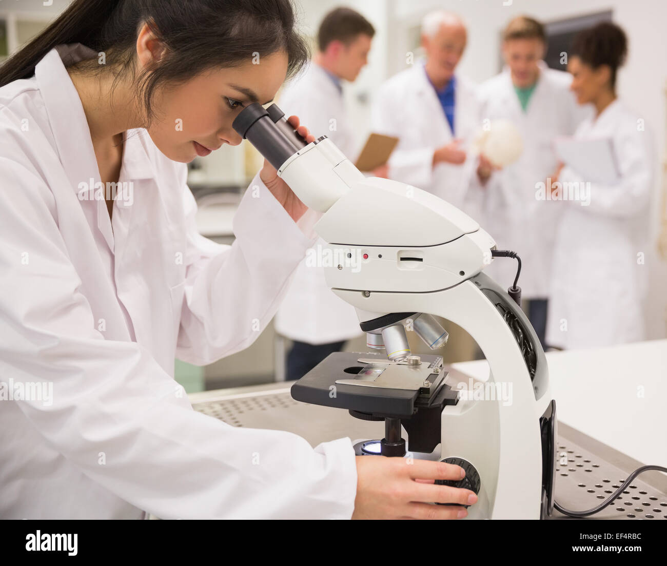 Young medical student working with microscope Stock Photo - Alamy