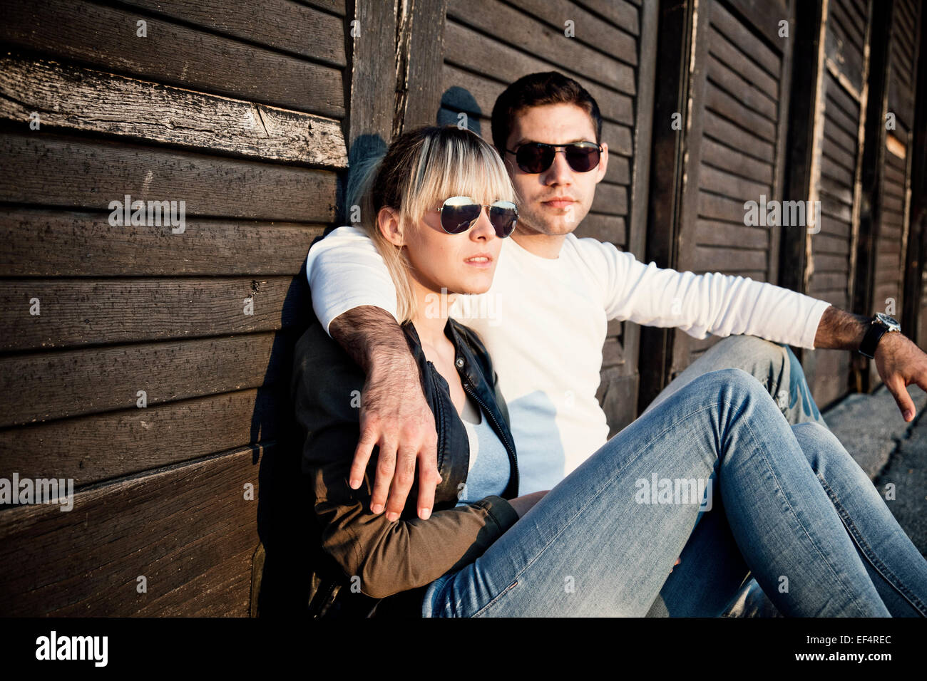 Young couple leaning against wooden gate Stock Photo - Alamy Young couple leaning against wooden gate Stock Photo - Alamy