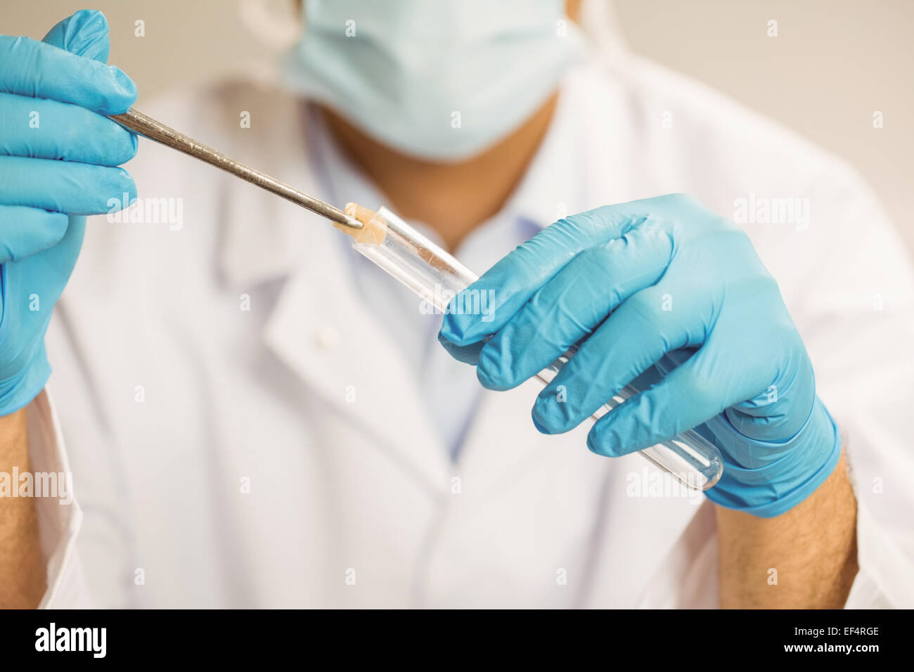 Food scientist putting raw chicken in test tube Stock Photo - Alamy