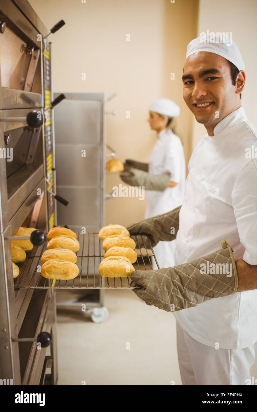 Smiling baker fresh bread hi-res stock photography and images - Alamy