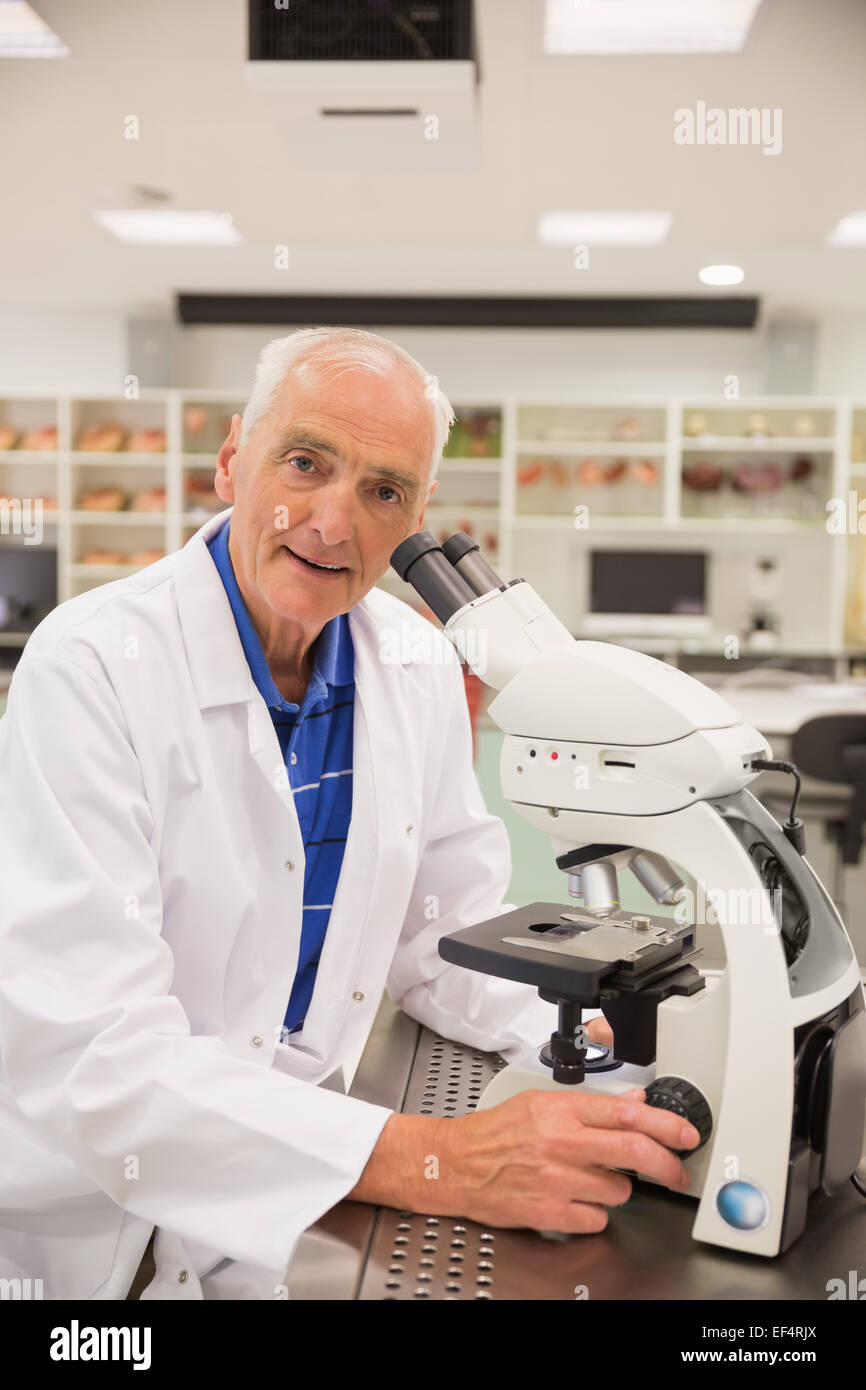 Medical professor working with microscope Stock Photo - Alamy