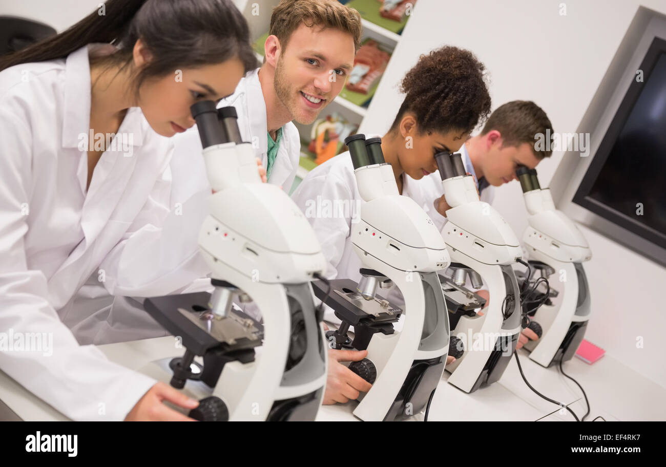 Medical students working with microscope Stock Photo - Alamy