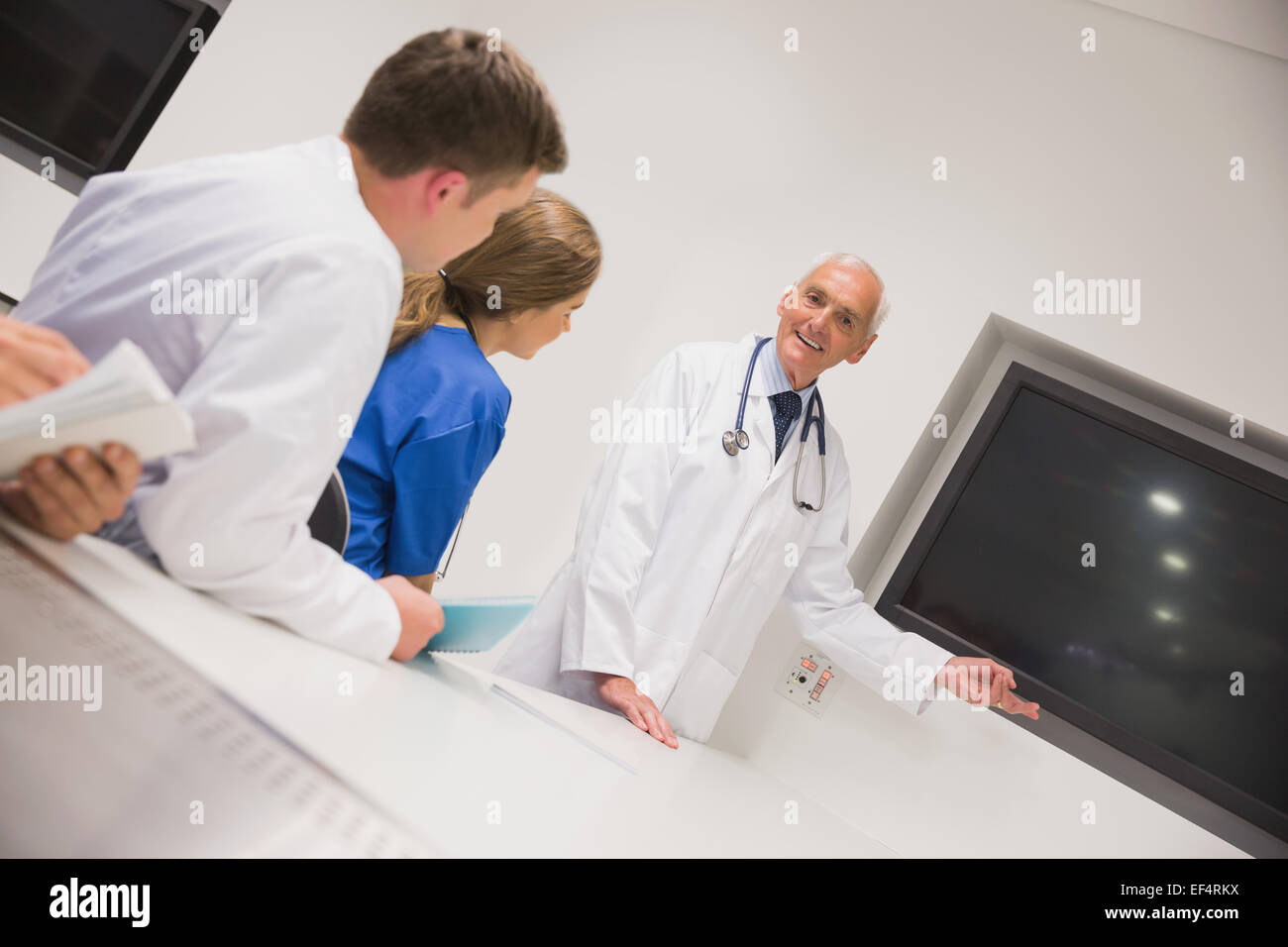 Medical professor teaching young students Stock Photo - Alamy