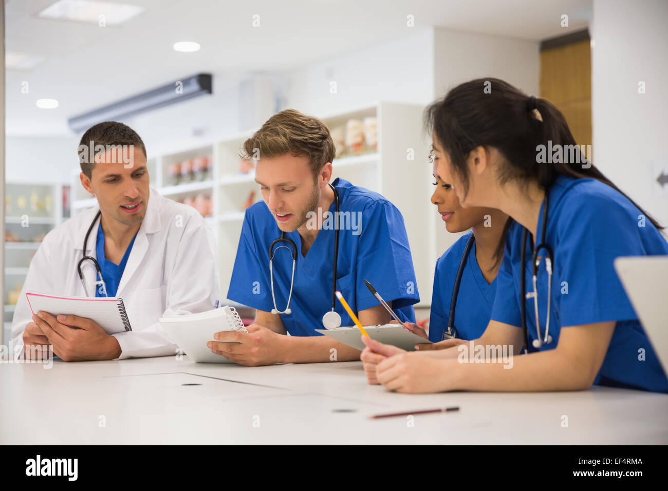 Science class lab students talking hi-res stock photography and images ...