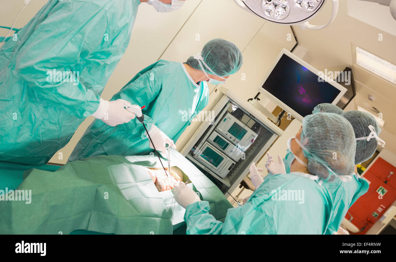 Medical students practicing surgery on model Stock Photo - Alamy