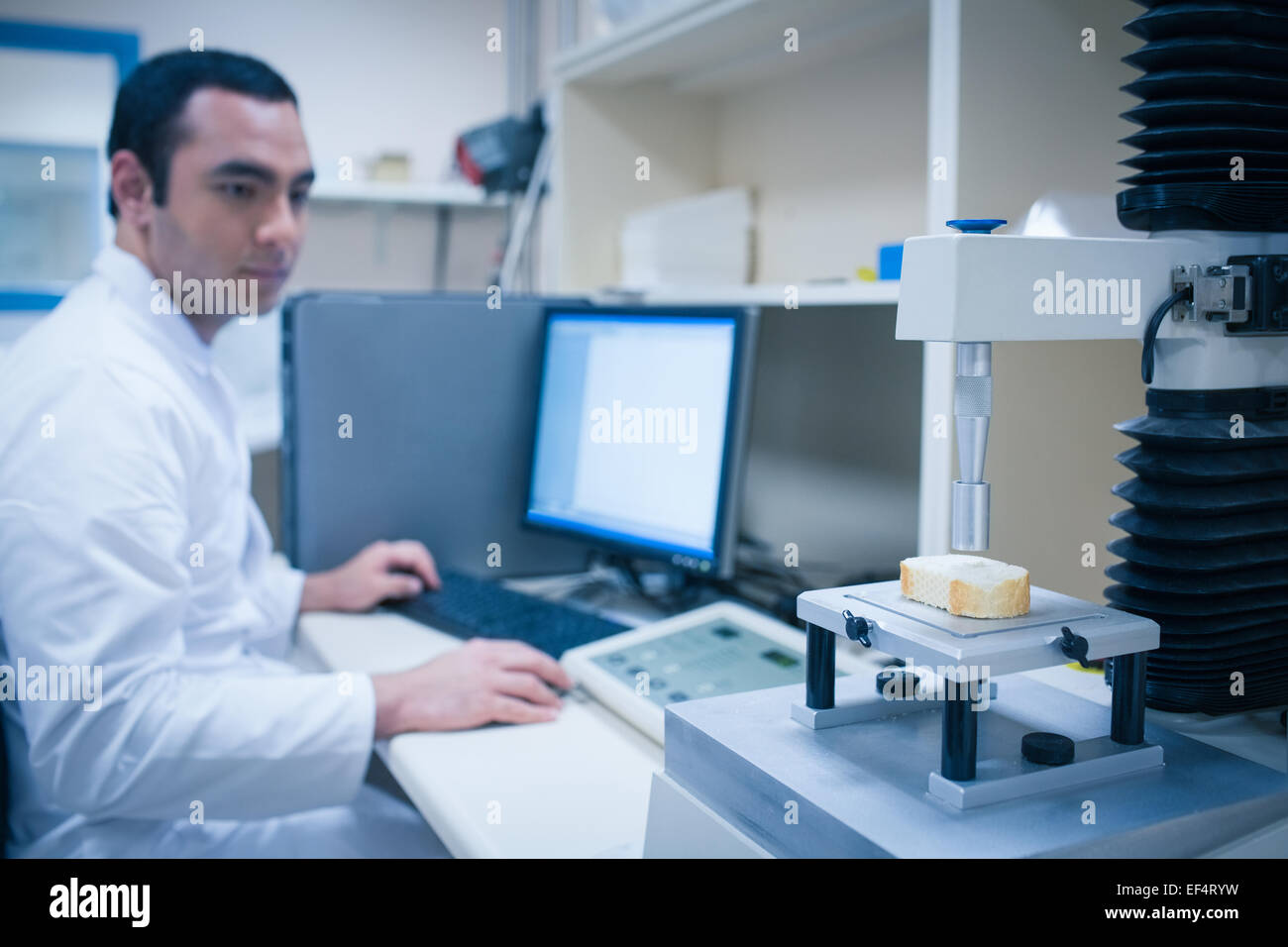 Food scientist using technology to analyse bread Stock Photo - Alamy