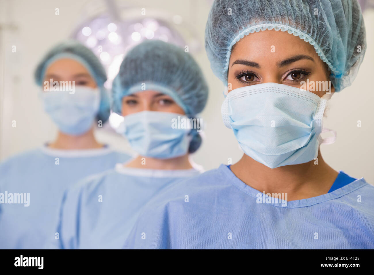 Medical students in operating theater looking at camera Stock Photo - Alamy
