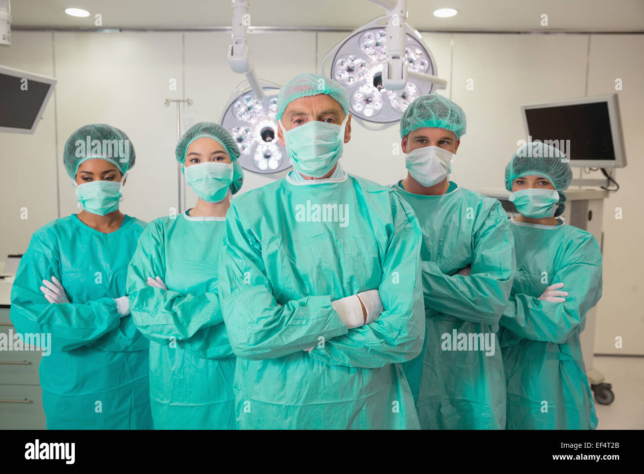 Medical student and lecturer looking at camera in scrubs Stock Photo ...
