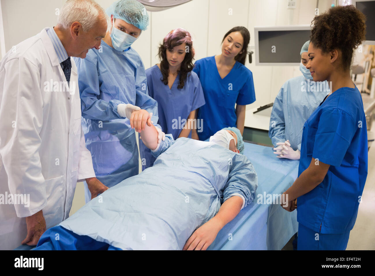 Medical students learning from professor Stock Photo - Alamy