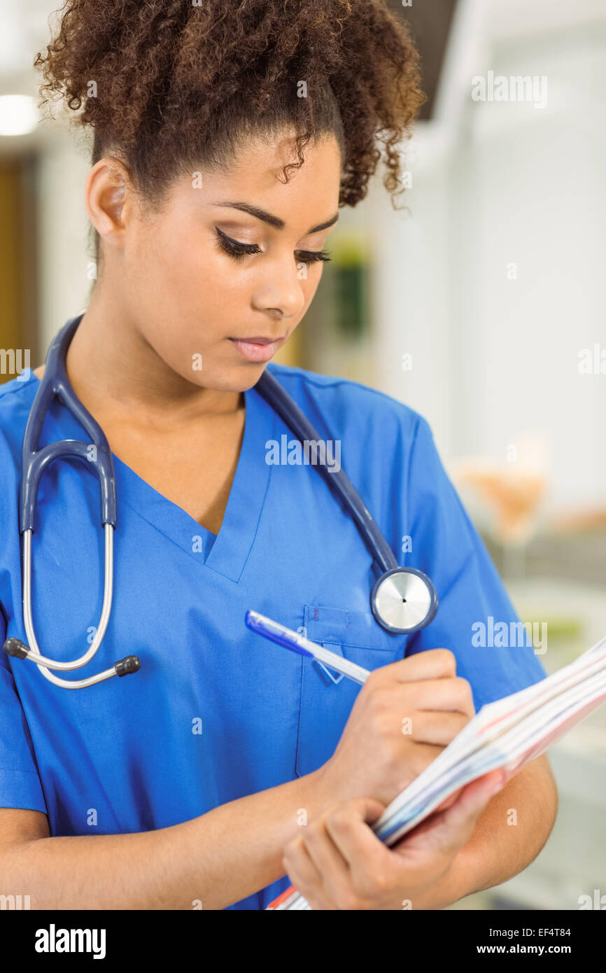 Young medical student taking notes Stock Photo - Alamy
