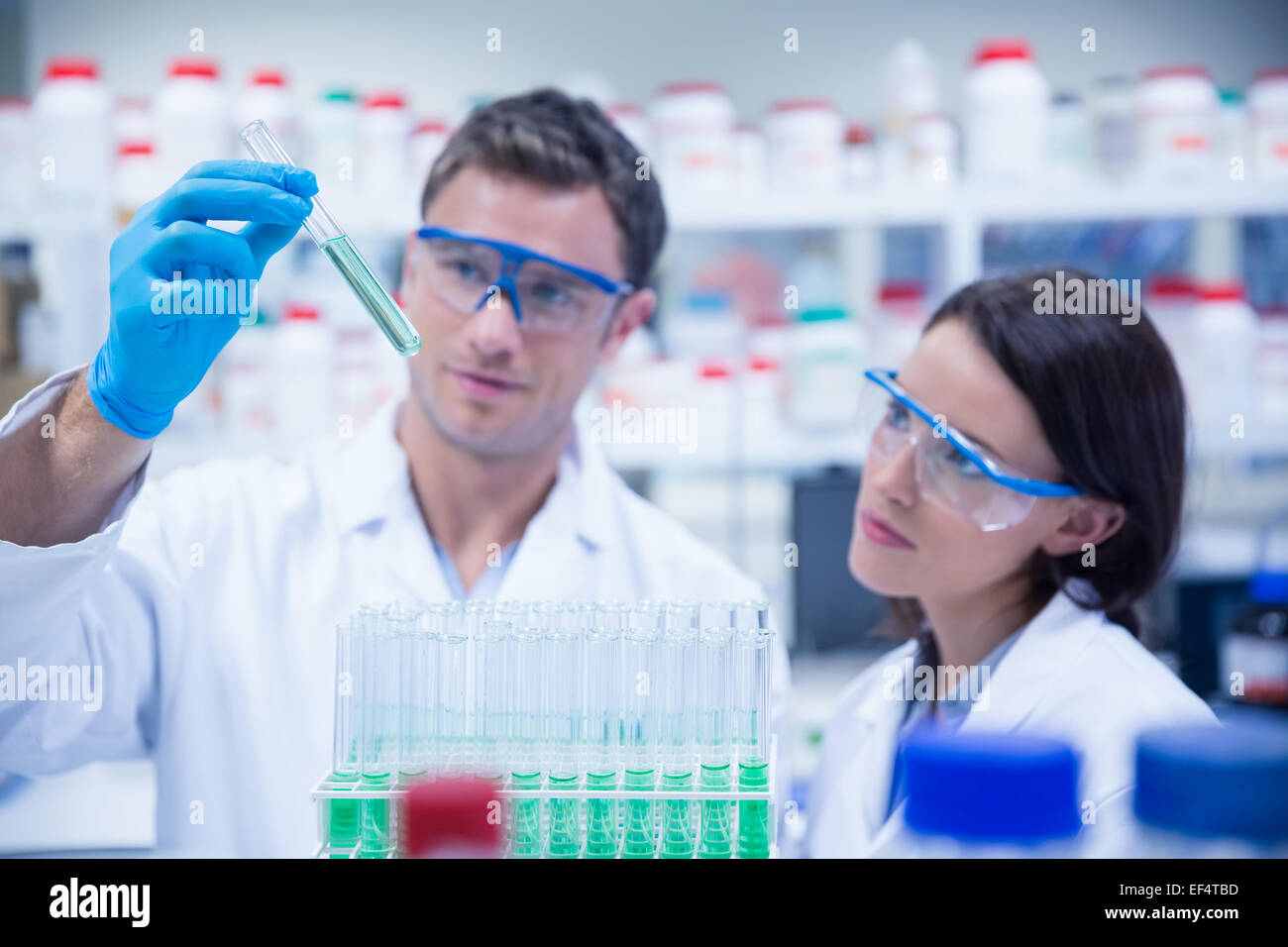 Female chemist studying test tube hi-res stock photography and images ...