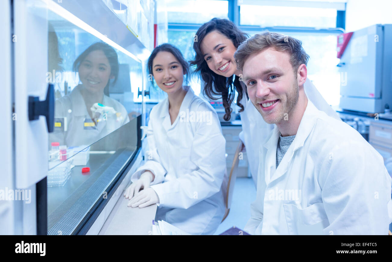 Science students using pipette in the lab Stock Photo - Alamy