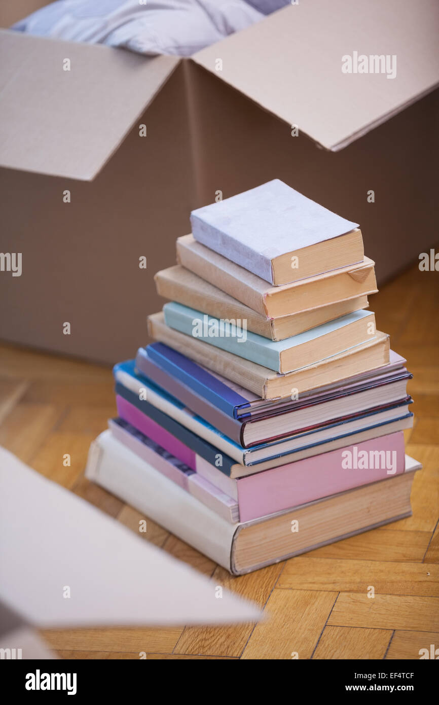 Pile of books on the floor Stock Photo - Alamy