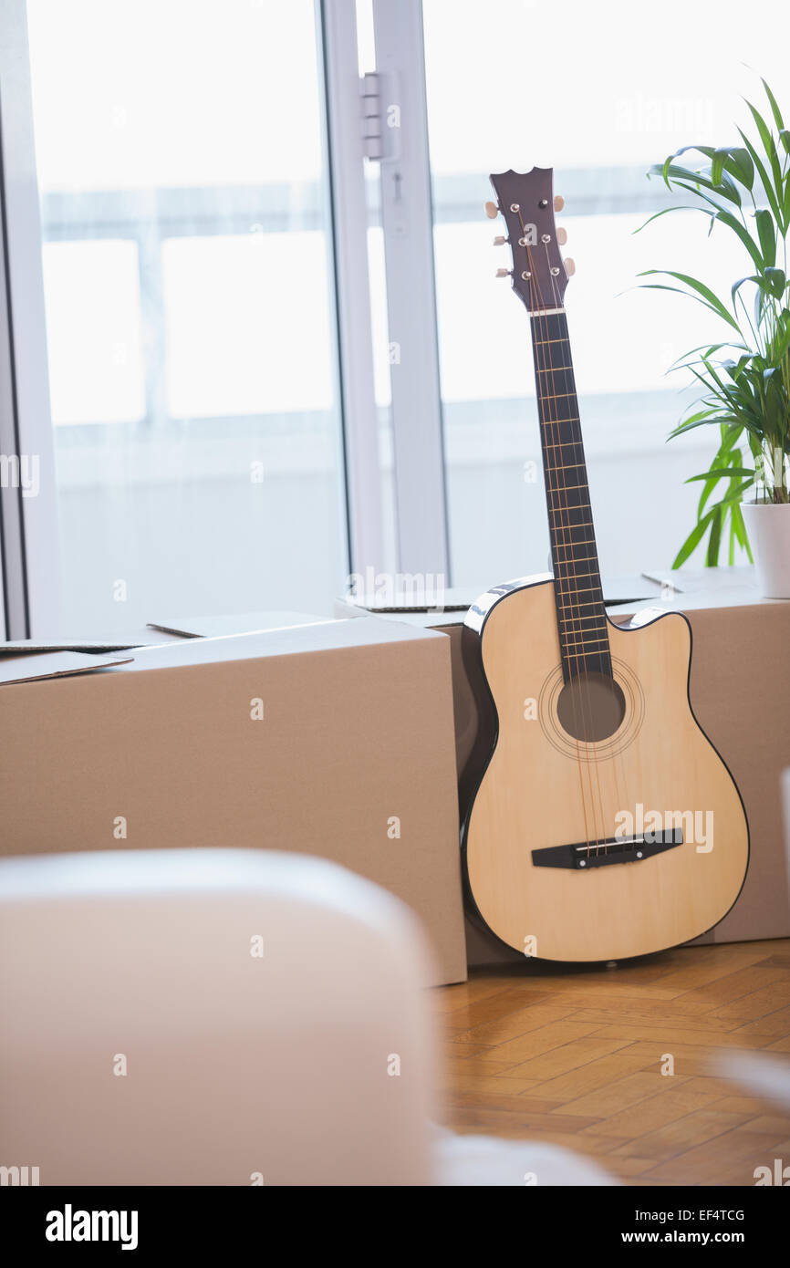 Guitar and cardboard boxes Stock Photo - Alamy