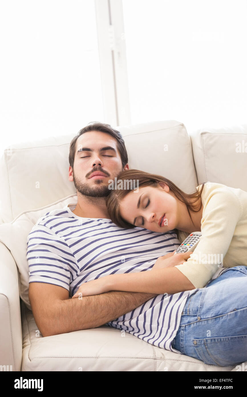 Cute couple napping on couch Stock Photo - Alamy