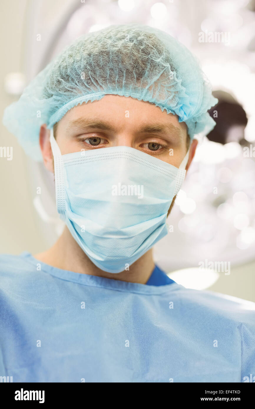 Young surgeon wearing mask and cap Stock Photo - Alamy