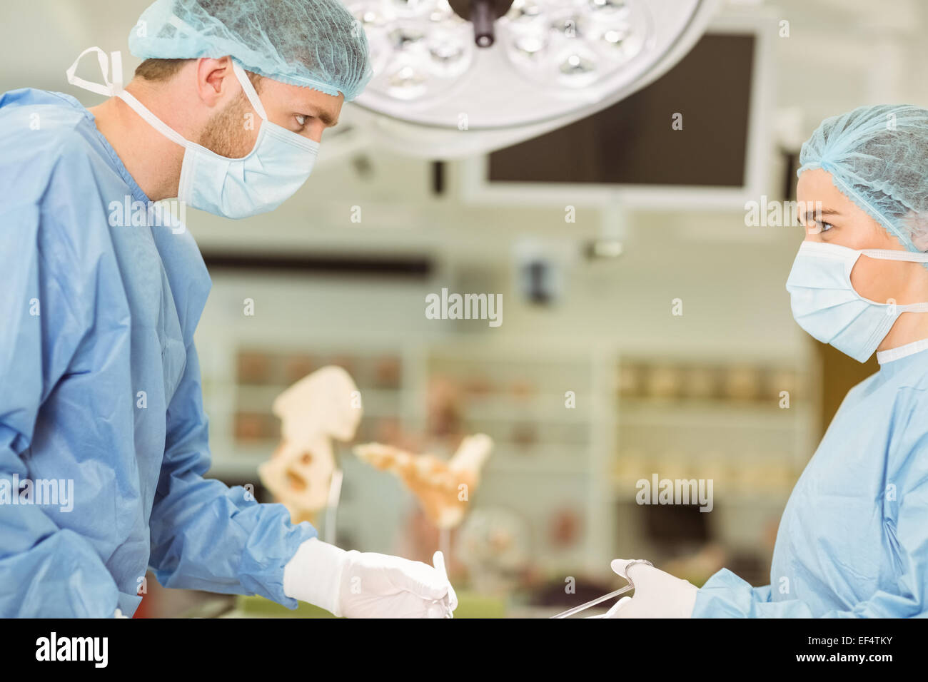 Team of surgeons working together Stock Photo - Alamy