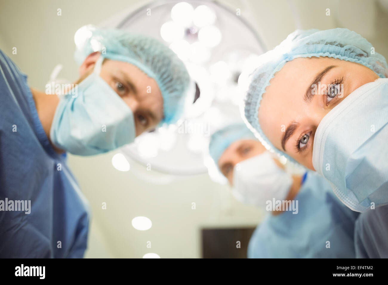 Team of surgeons working together Stock Photo - Alamy