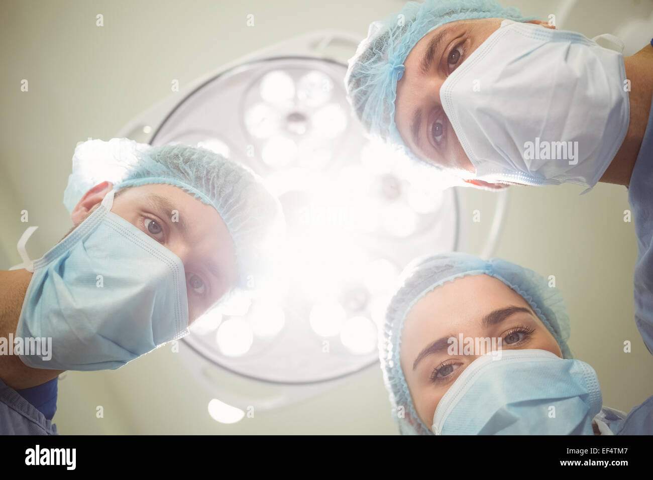 Team of surgeons working together Stock Photo - Alamy