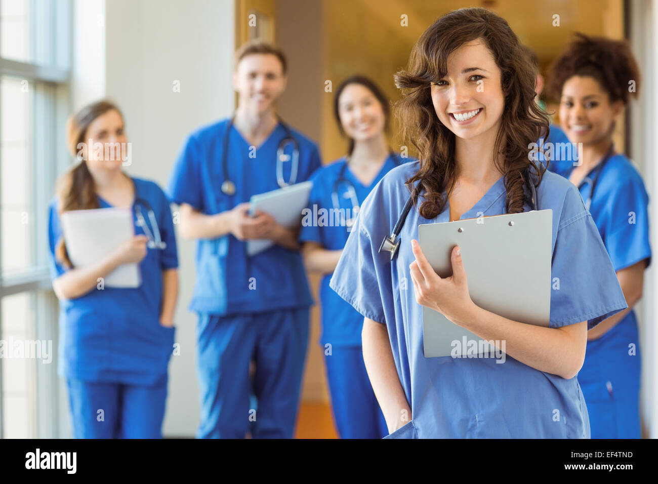 Medical students smiling at the camera Stock Photo - Alamy