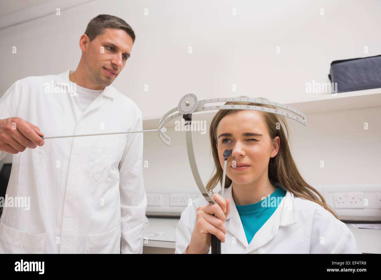 Woman doing vision test hi-res stock photography and images - Alamy