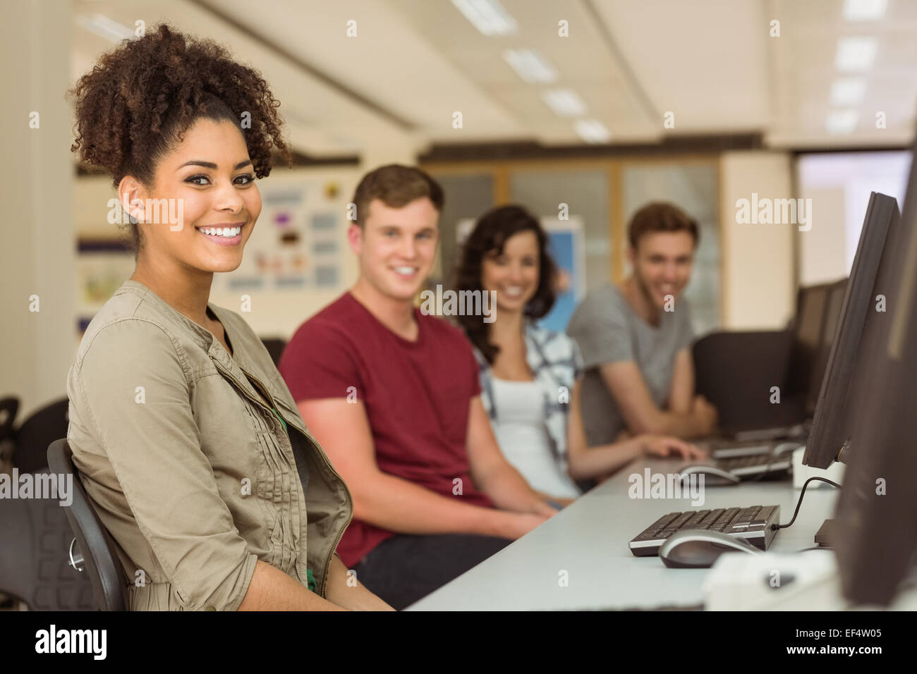 Classmates working in the computer room Stock Photo - Alamy
