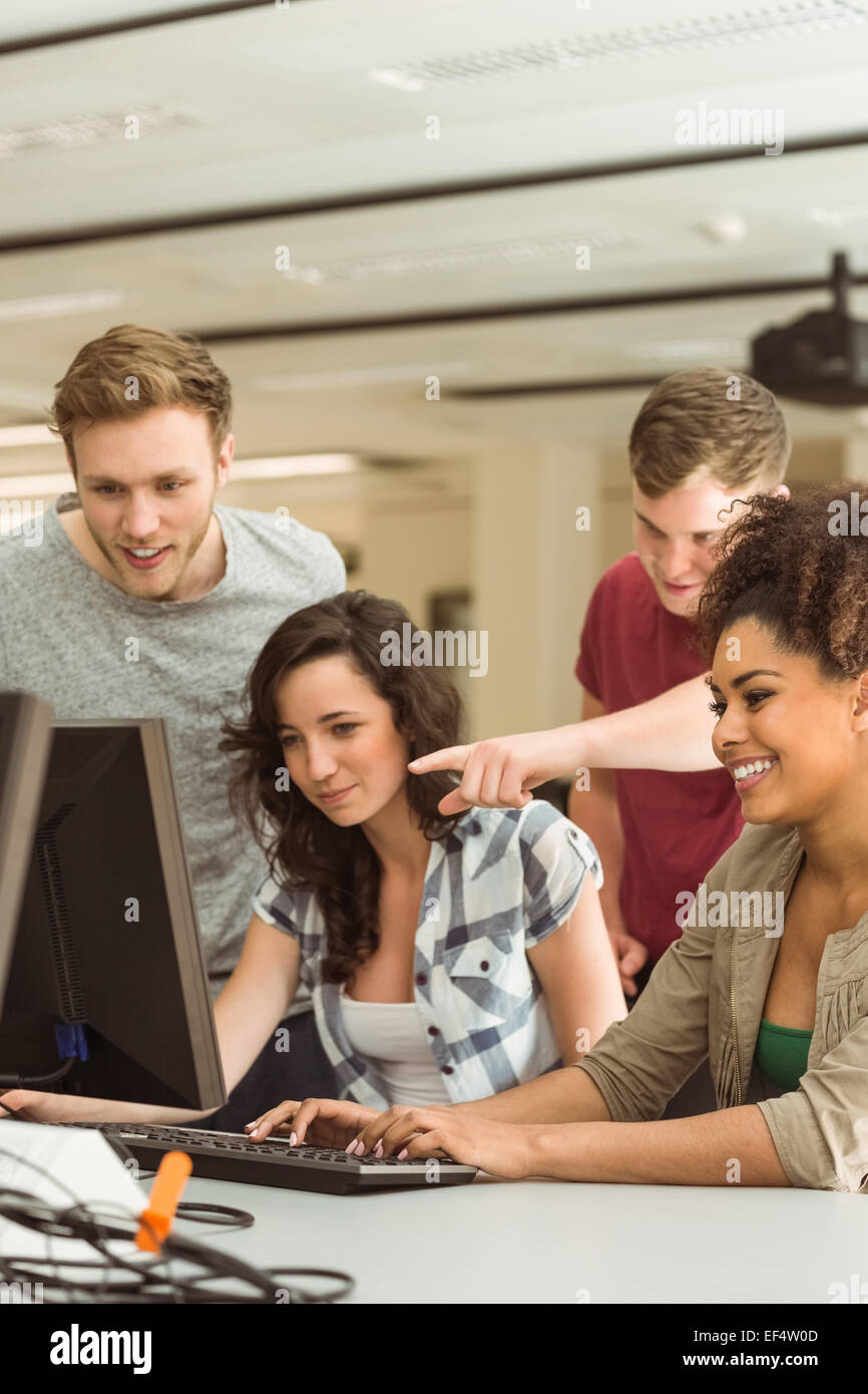 Classmates working together in the computer room Stock Photo - Alamy