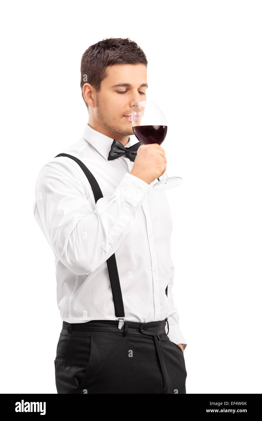 Elegant guy drinking red wine isolated on white background Stock Photo ...