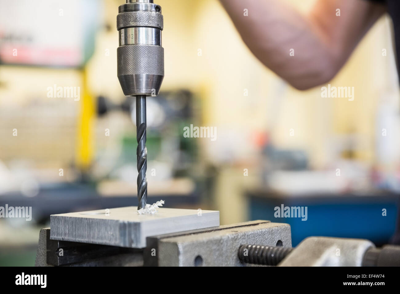 Engineering student using large drill Stock Photo - Alamy