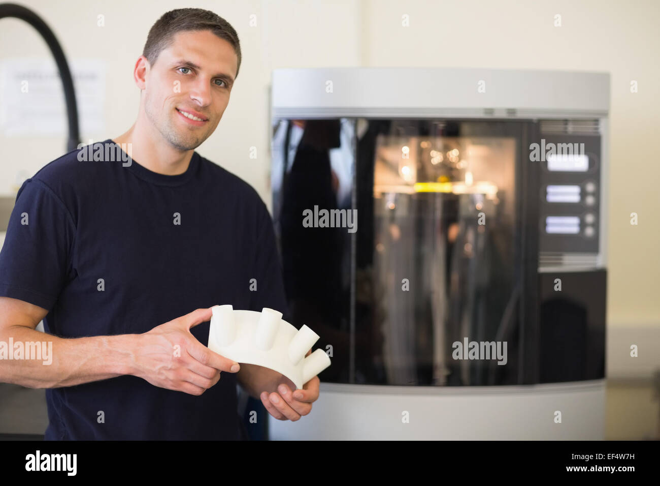 Engineering student holding object printed from 3d printer Stock Photo ...