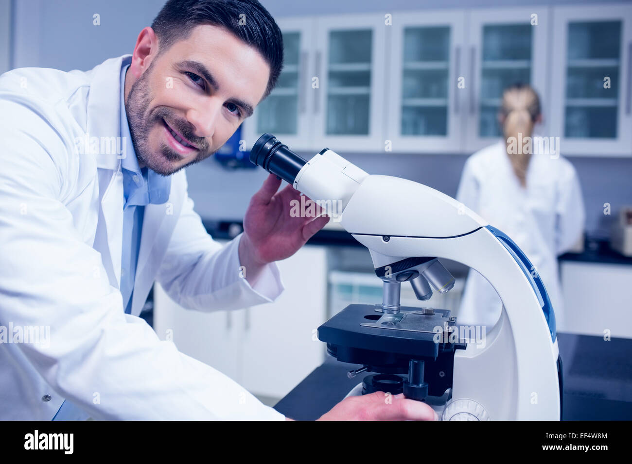 Science student working with microscope in the lab Stock Photo - Alamy