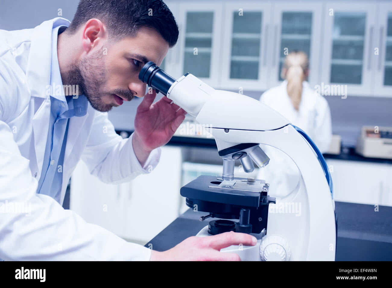 Science student working with microscope in the lab Stock Photo - Alamy