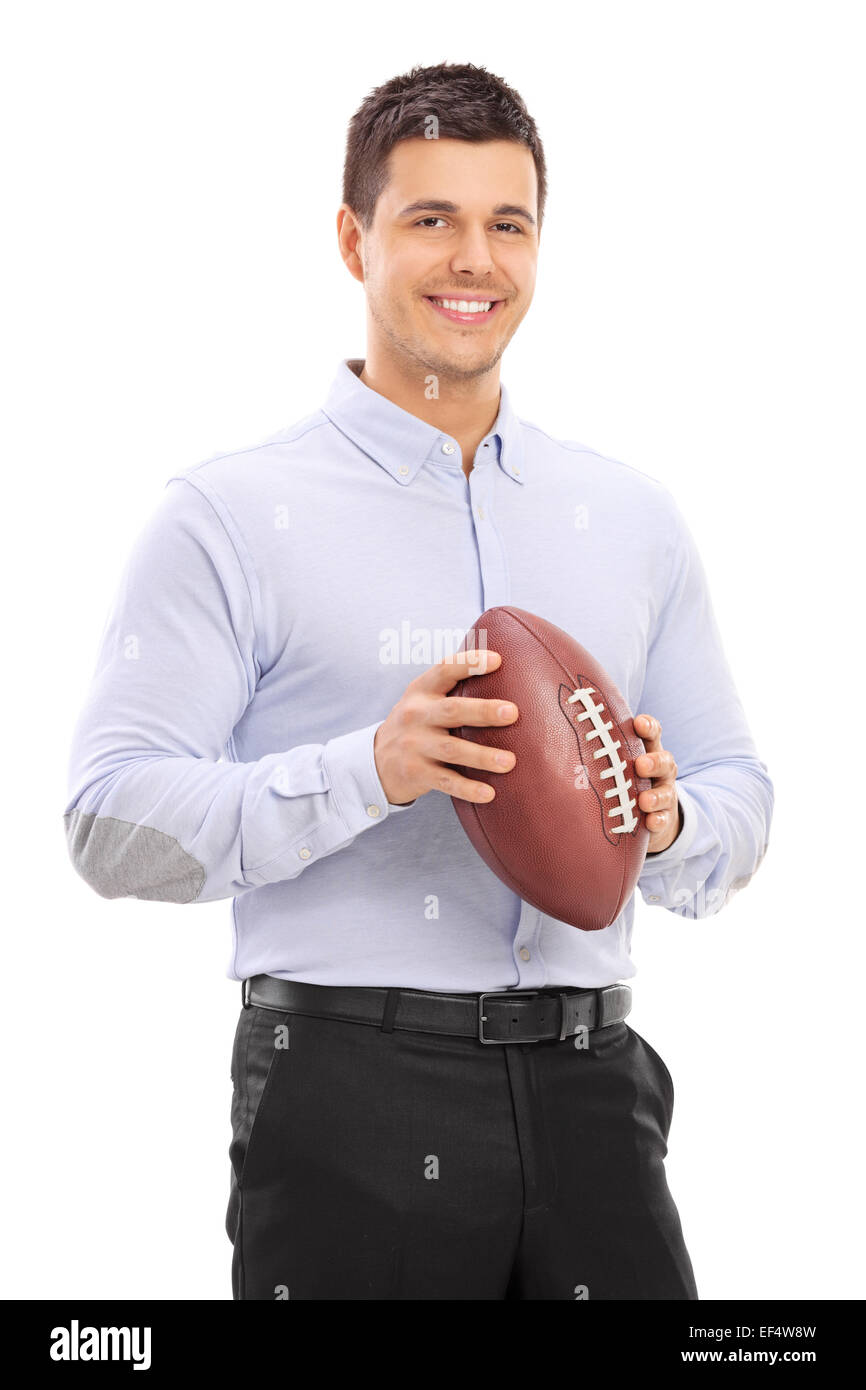 Man holding an American football and posing isolated on white ...