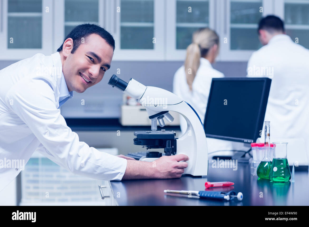 Science student working with microscope in the lab Stock Photo - Alamy