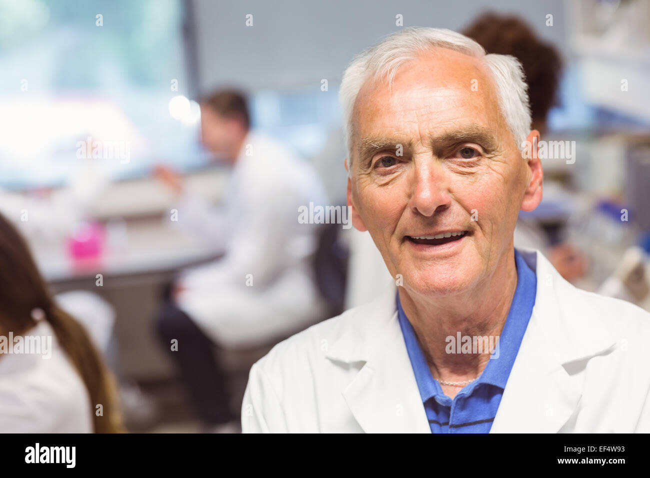 Science lecturer smiling at camera Stock Photo - Alamy