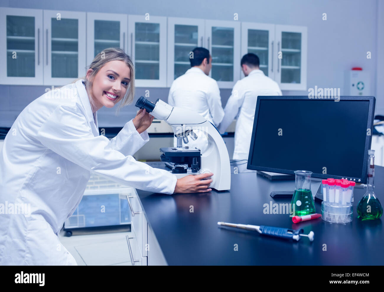 Science student working with microscope in the lab Stock Photo - Alamy