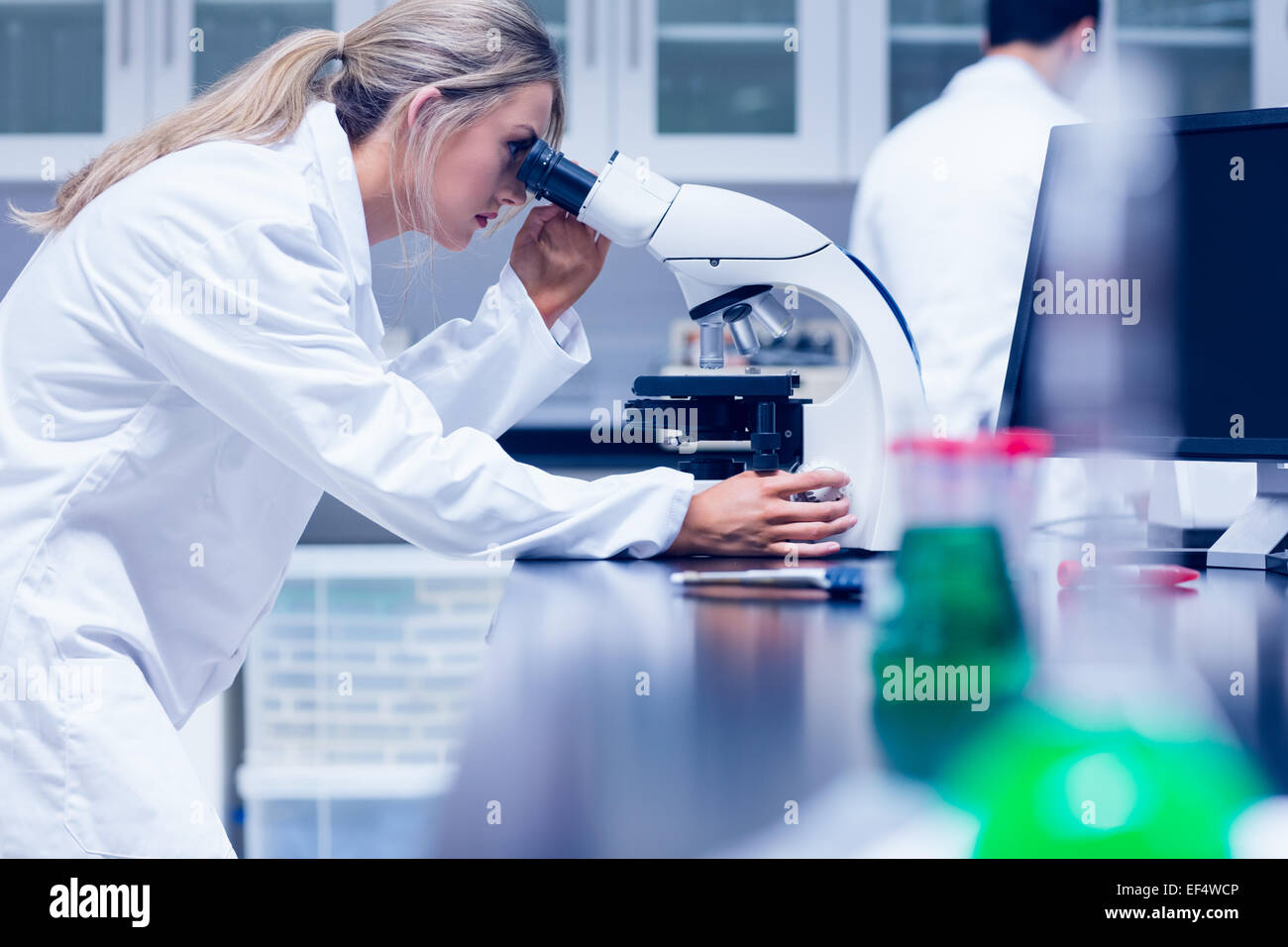 Science student working with microscope in the lab Stock Photo - Alamy