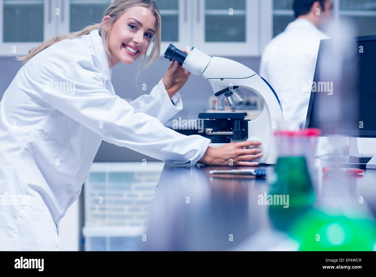 Science student working with microscope in the lab Stock Photo - Alamy