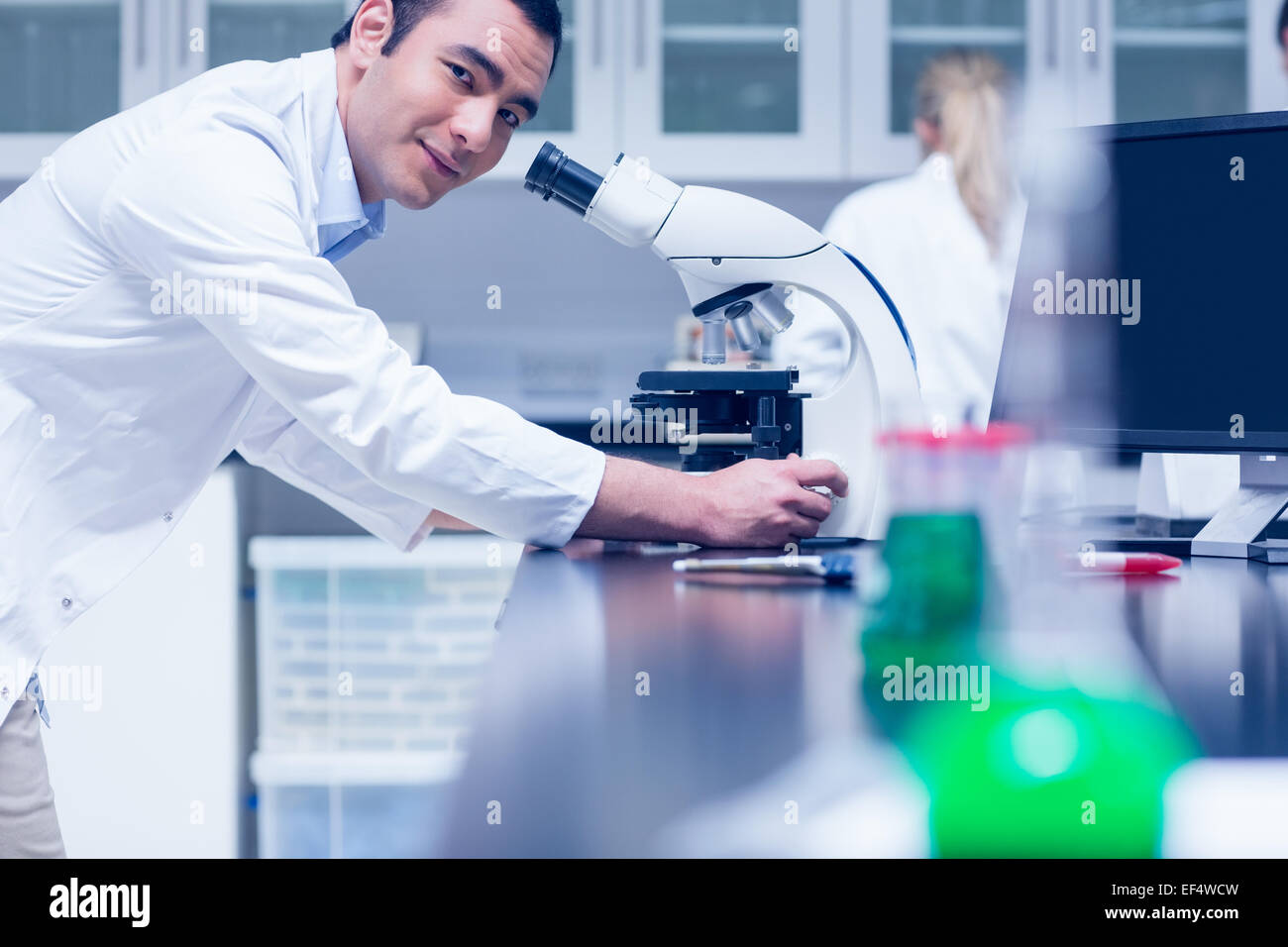 Science student working with microscope in the lab Stock Photo - Alamy