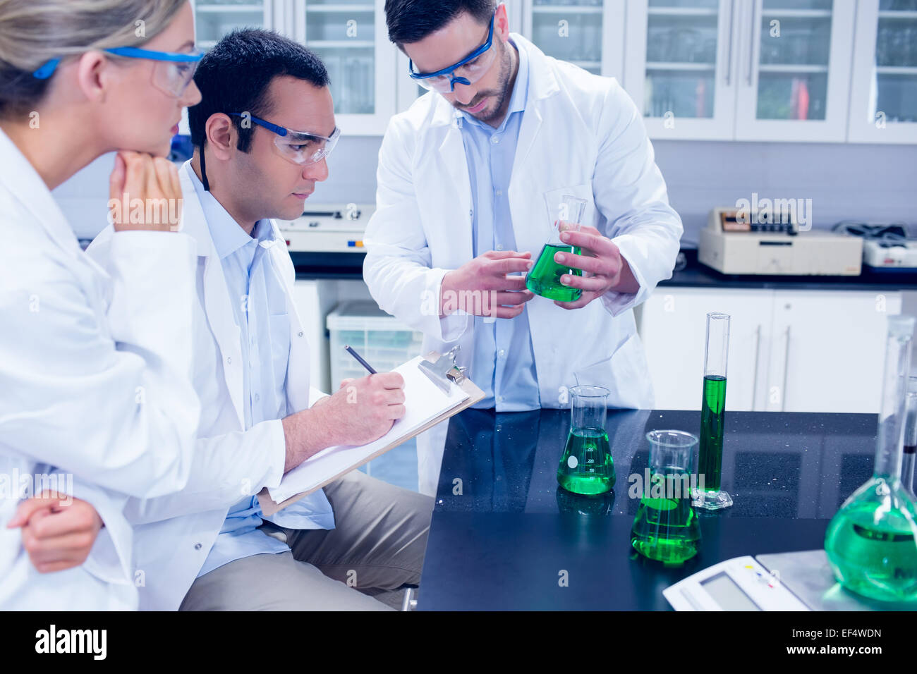 Science students working together in the lab Stock Photo - Alamy