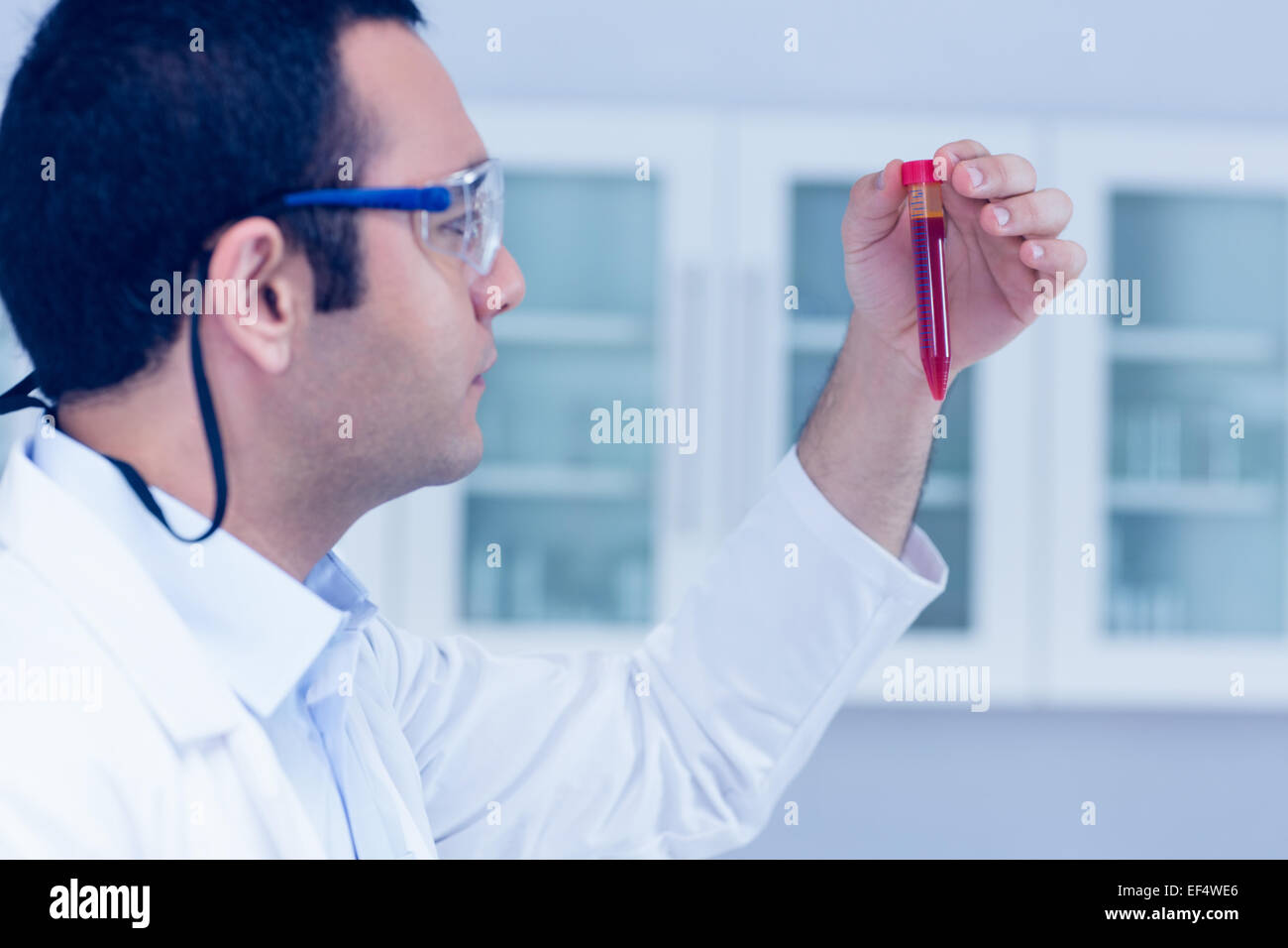 Scientist holding vial medical hi-res stock photography and images - Alamy